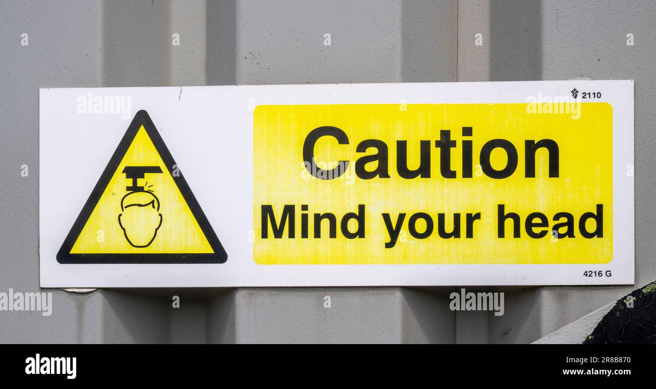 Hazard Warning – A Caution Mind Your Head sign Stock Photo - Alamy