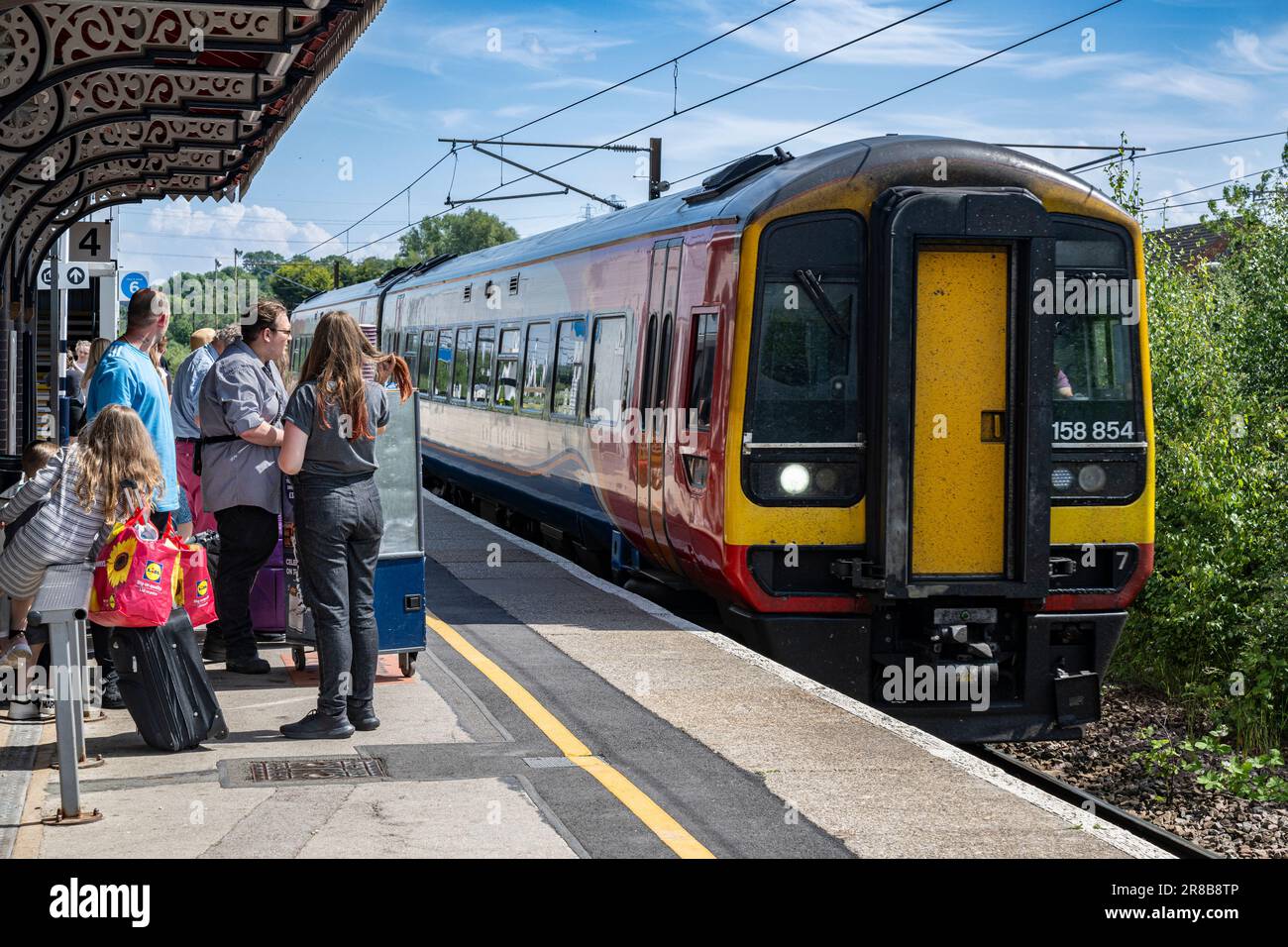 Grantham Train Station – Passengers and travellers waiting on the platform for the arrival of ...