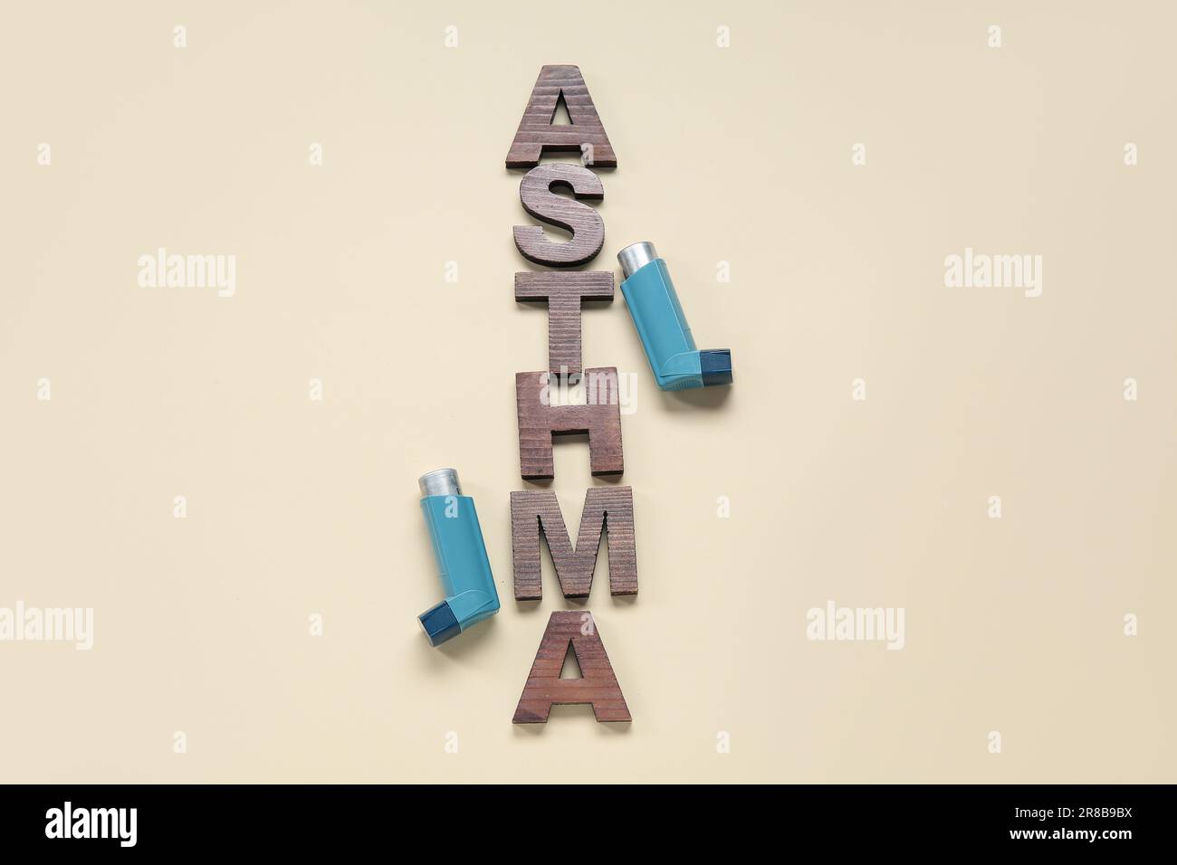 Word ASTHMA and inhalers on grey background Stock Photo - Alamy