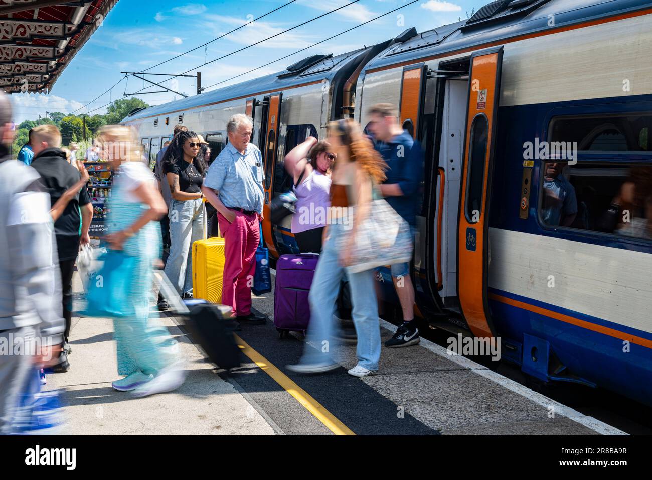 Grantham Train Station – Passengers stood on a platform waiting to board an East Midlands ...
