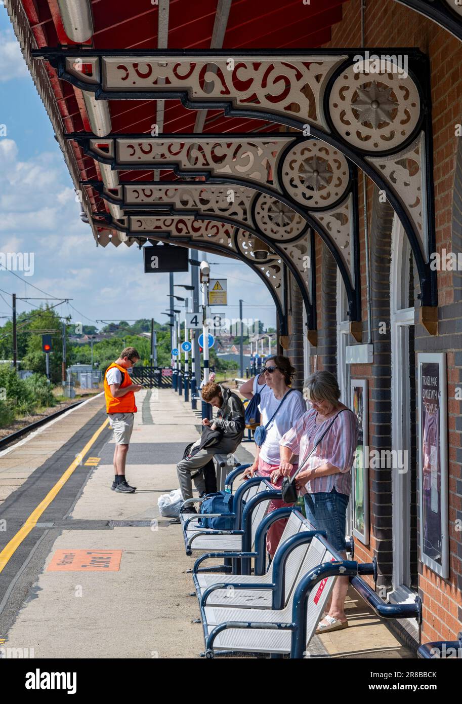 Grantham Train Station – Passengers and travellers waiting on the platform for the arrival of ...