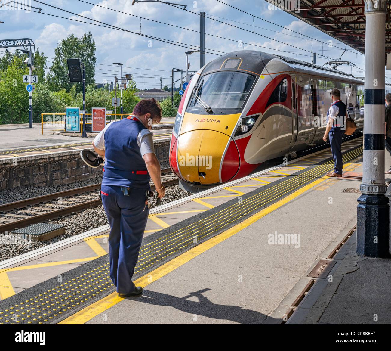 Grantham Train Station – A female conductor or guard watching the ...