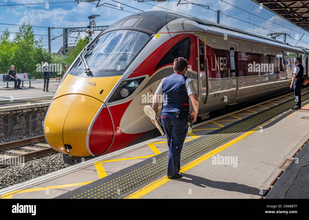 Grantham Train Station – A female conductor or guard watching the ...