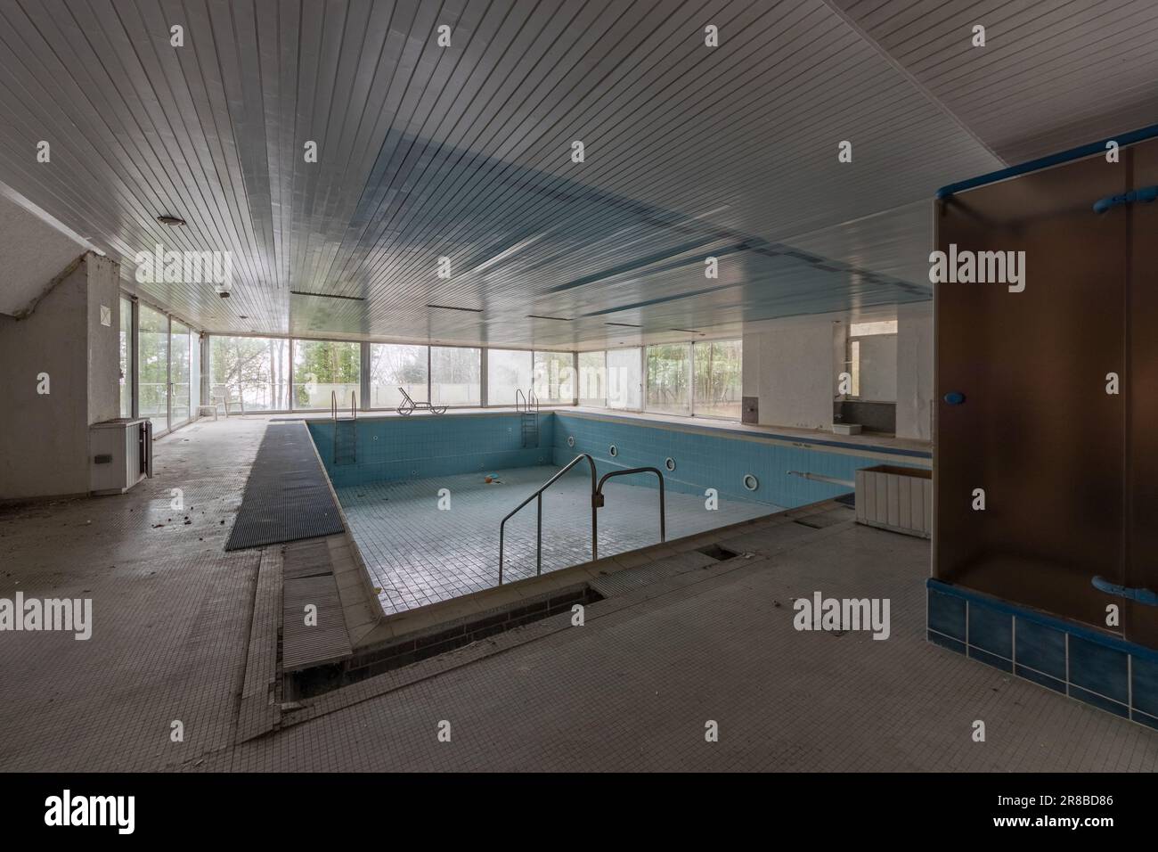 Old swimming pool or indoor pool without water which is no longer used ...