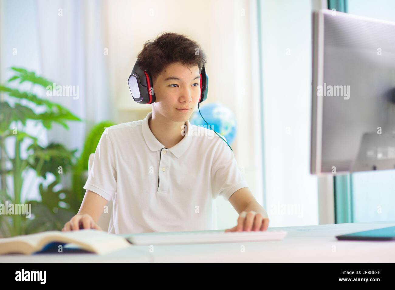 Child doing homework on computer. Online class. Homeschooling and ...