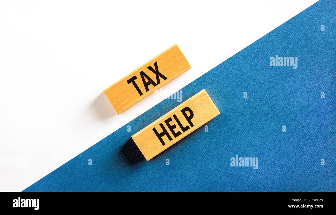 Tax help symbol. Concept words Tax help on wooden blocks on a beautiful ...