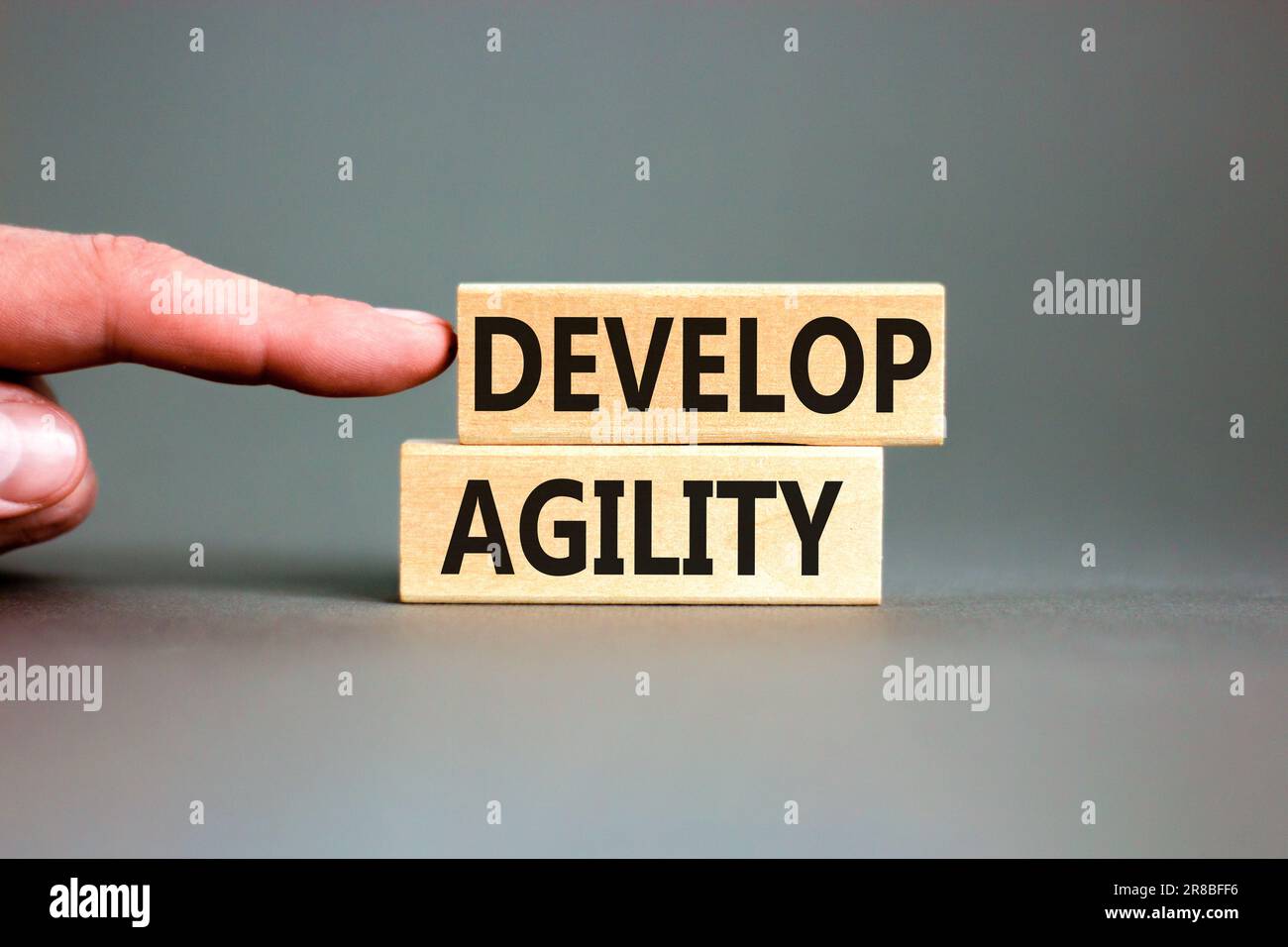 Develop agility symbol. Concept words Develop agility on wooden blocks ...