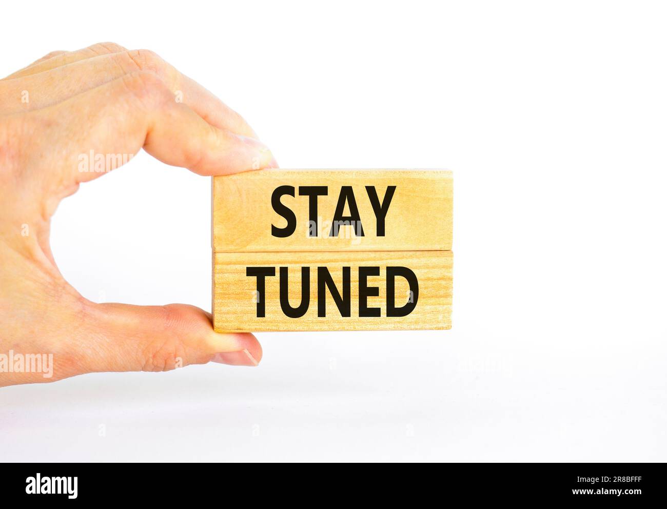Stay tuned symbol. Concept words Stay tuned on wooden blocks on a ...