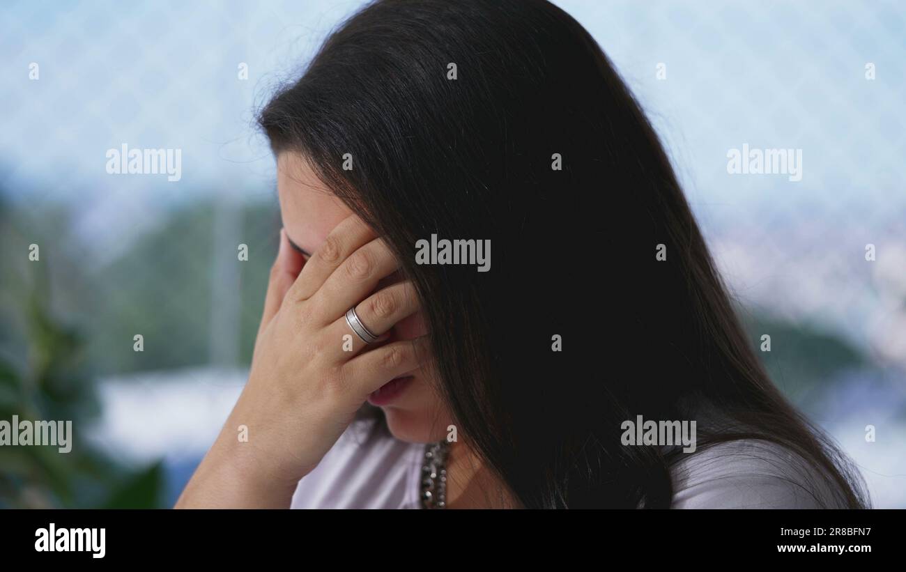 Remorseful Expression of a Diverse Asian Young Woman Covering Her Face ...