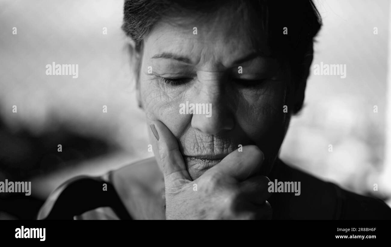 Older female contemplating Black and White Stock Photos & Images - Alamy