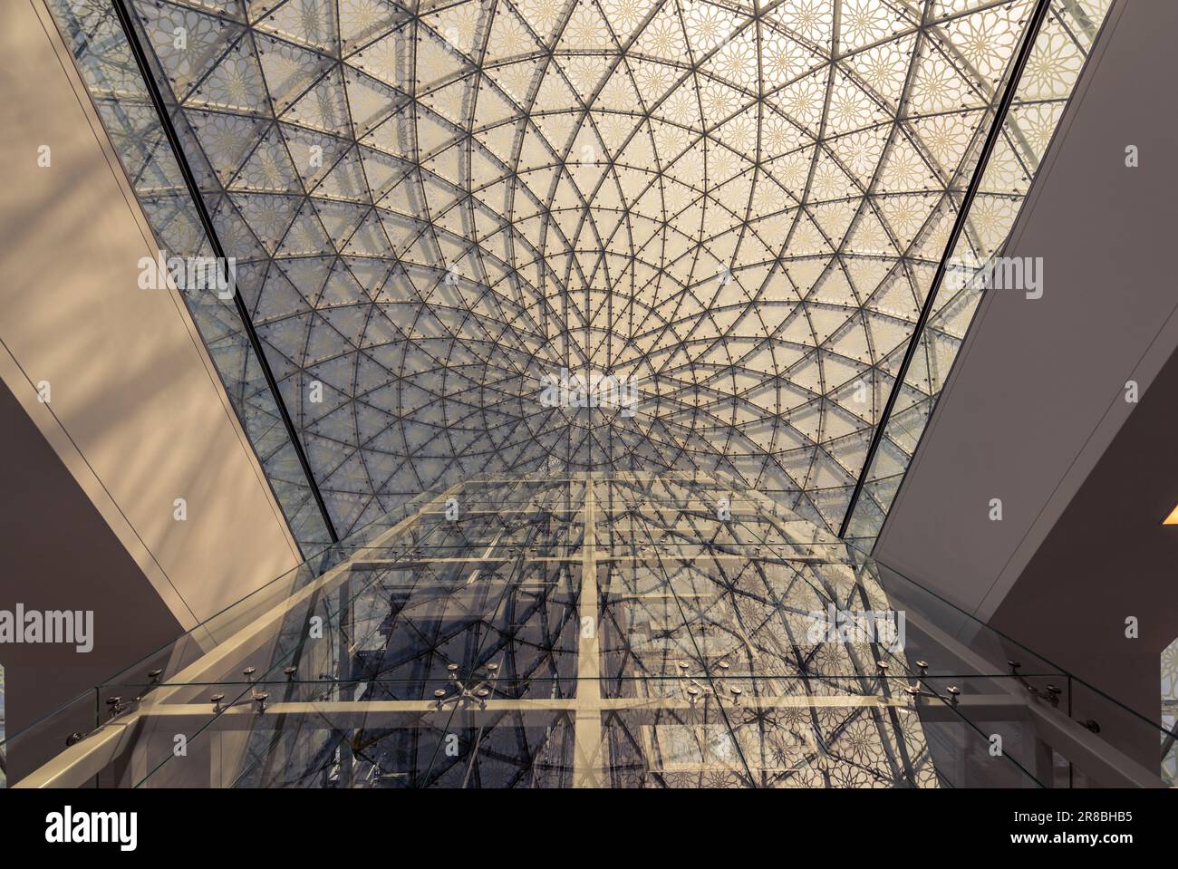 An aerial view of a glass ceiling illuminating the entrance of an art ...
