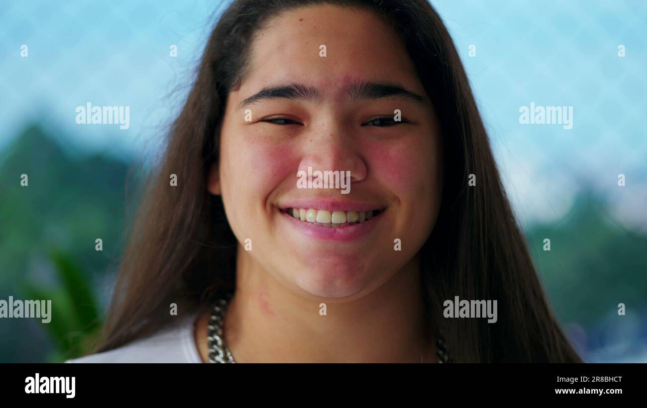 One Asian young woman portrait face looking at camera with serious ...