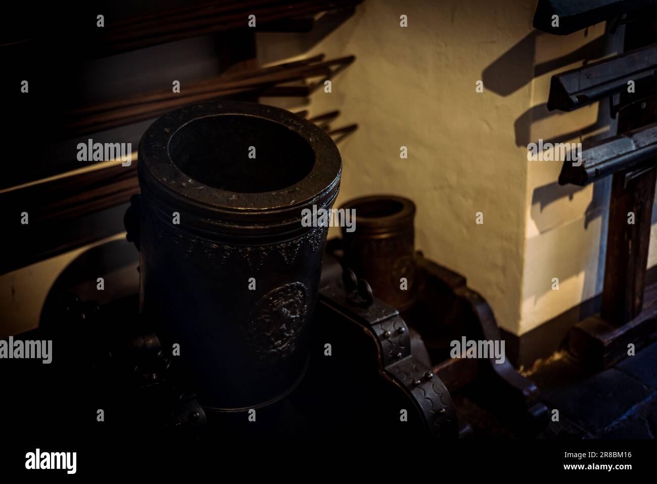 An closeup of an old-fashioned smoking pipe resting on a wall ...