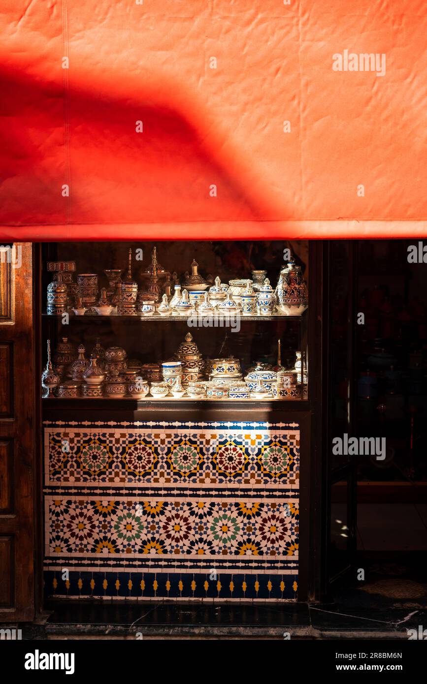 Close-up view of a retail display case filled with glass bottles and ...