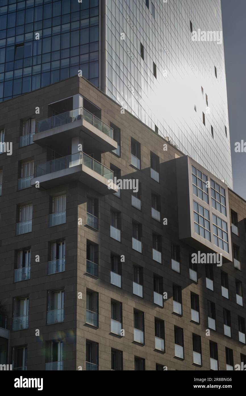 Facade of a modern brick building in its lower part and a part above it ...