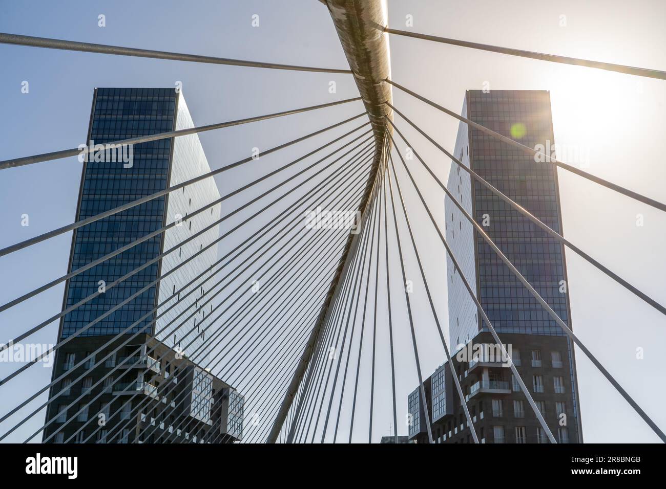 Twin modern office buildings with reflective facades behind a modern ...