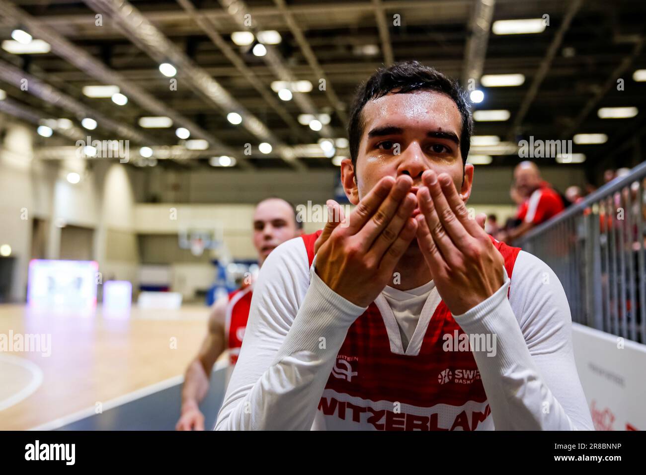 Basketball athletes from Switzerland cheer after winning a match during ...