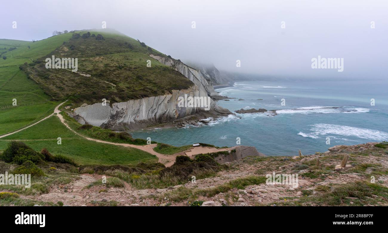 Algorri beach near Zumaia, Basque Country with green mountains and high ...