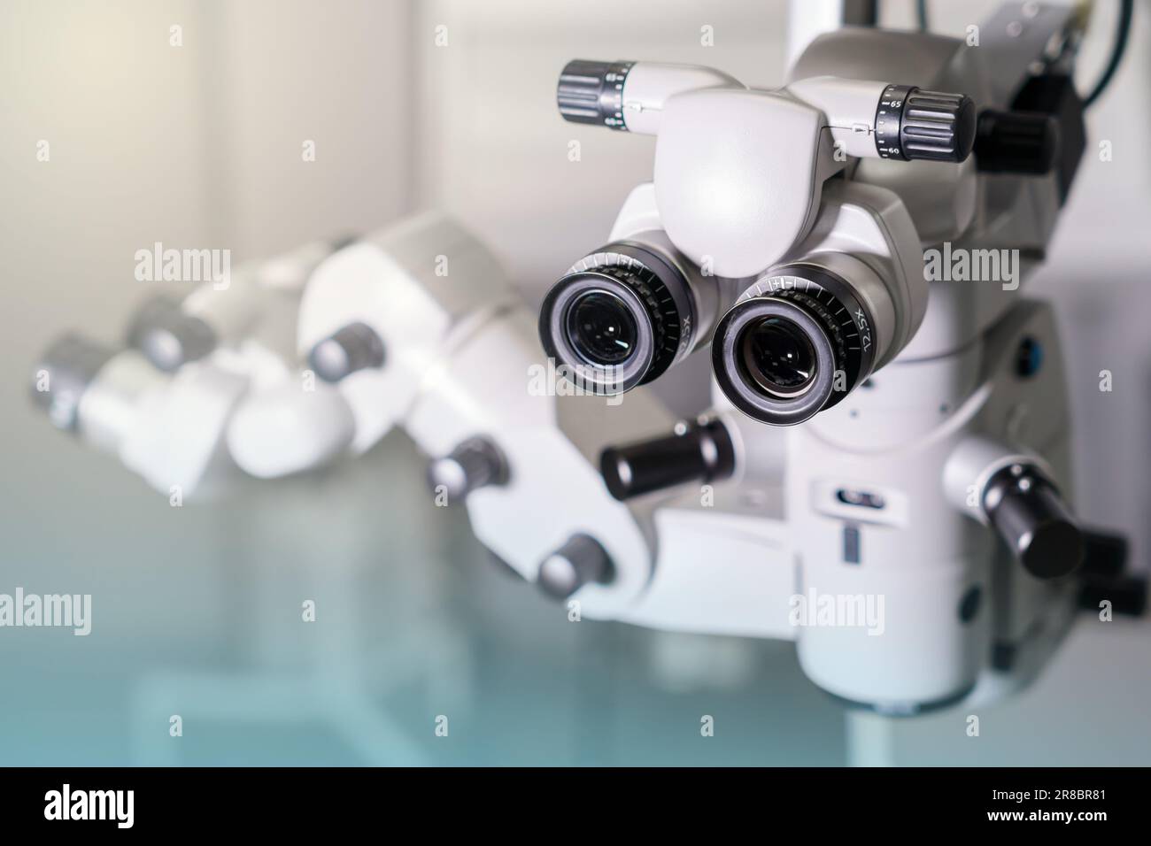 Surgical microscope in operating room with doctors. Ophthalmological ...