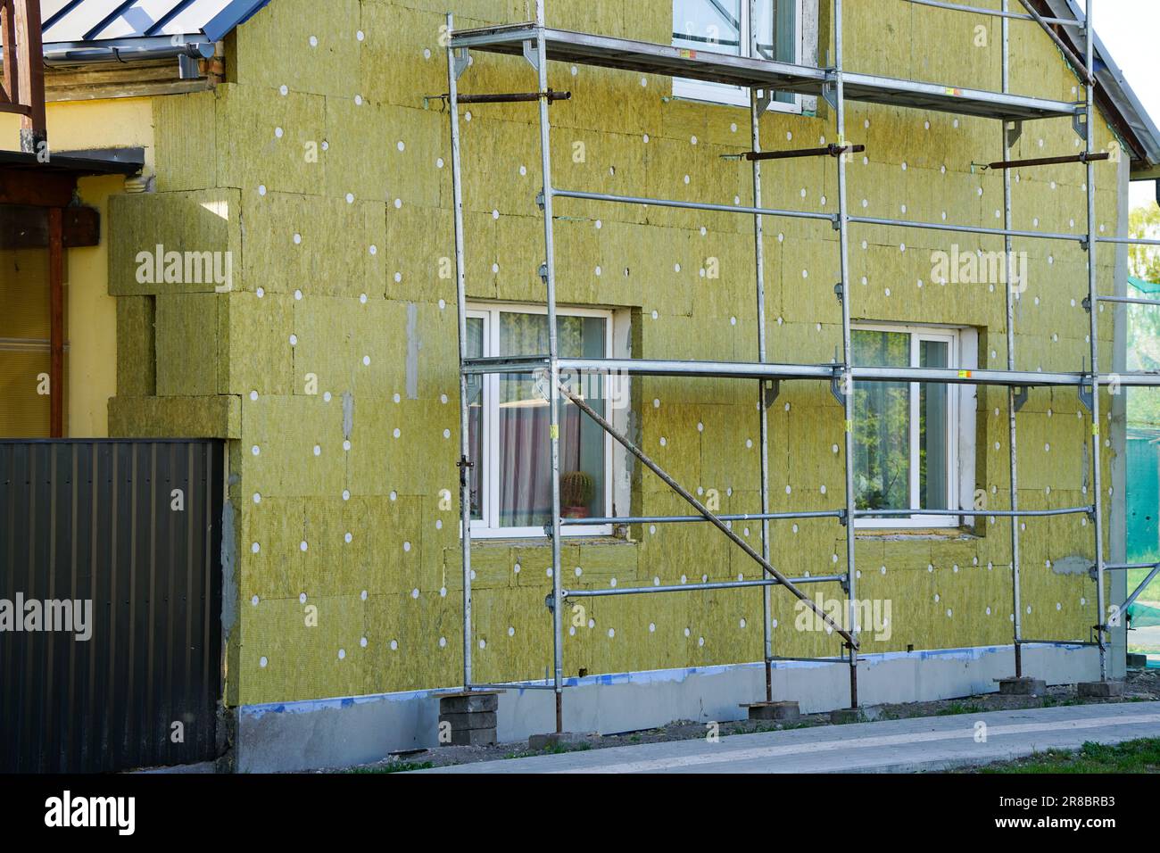 Thermal insulation of the facade of the residential house with thick ...