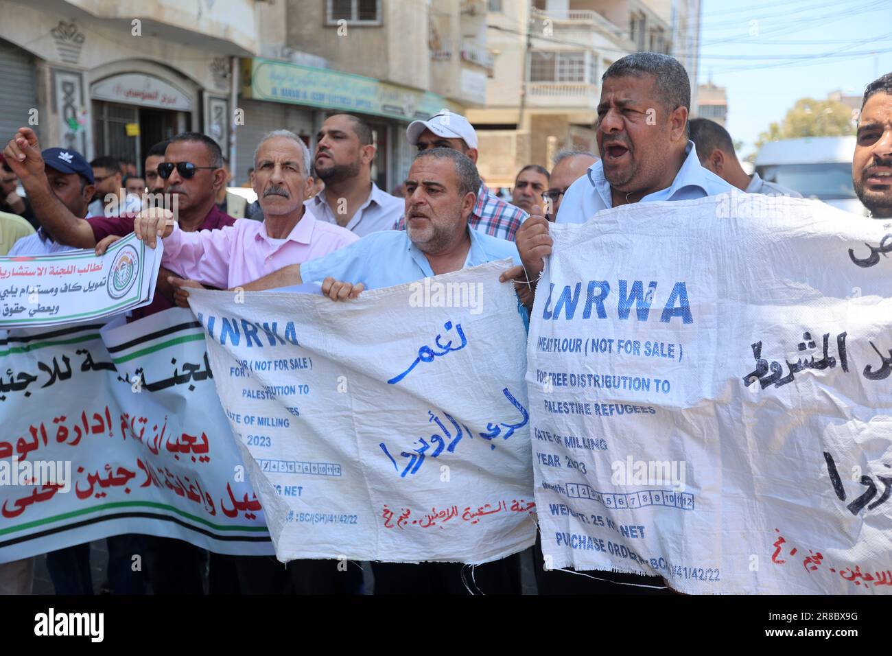 Gaza, Palestine. 20th June, 2023. Protesters march with placards ...