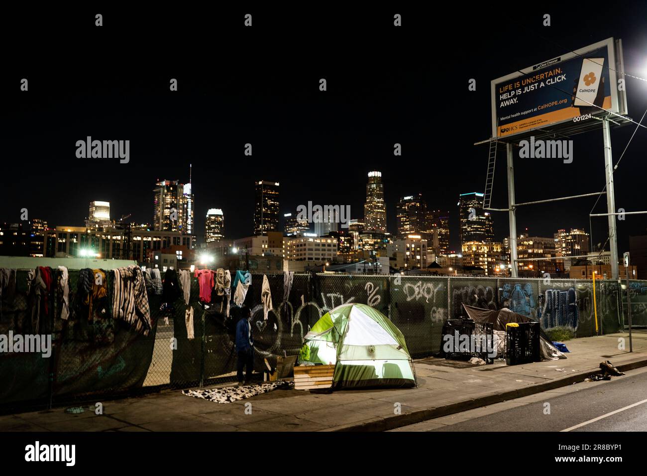 In this photo illuminated by an off-camera flash, a homeless person's ...