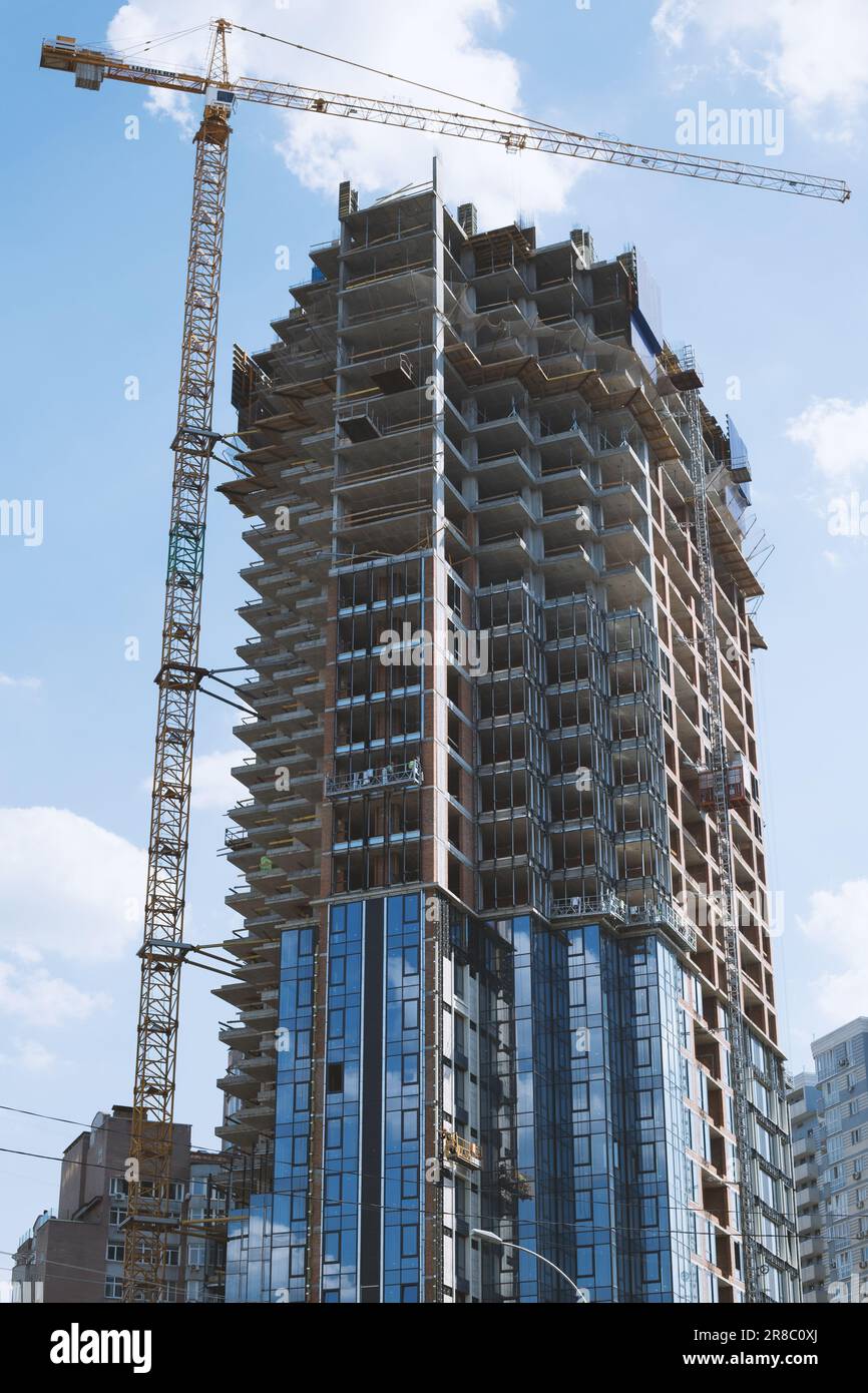 Skyscraper construction. building and tower crane Stock Photo - Alamy