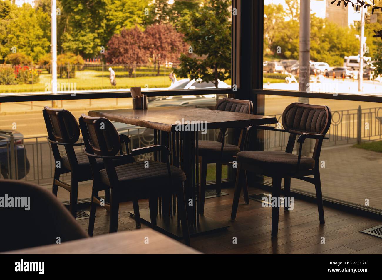 The interior of the restaurant. Tables next to the window Stock Photo ...