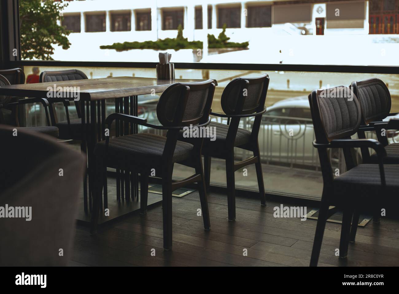 The interior of the restaurant. Tables next to the window Stock Photo ...