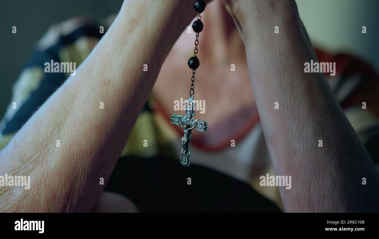 Catholic Religious older woman Praying the Rosary having HOPE and FAITH ...