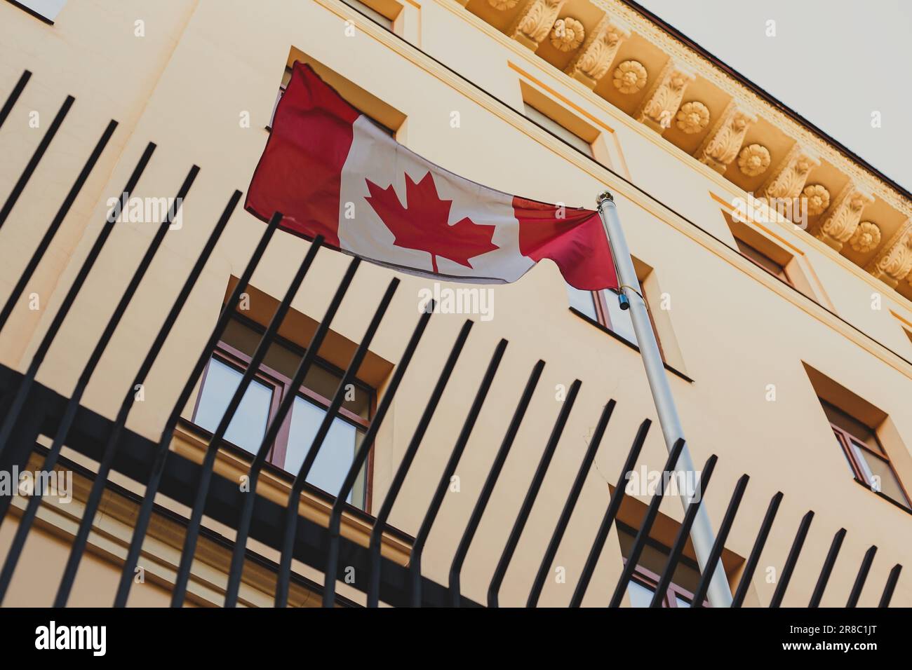 Flag of Canada on the background of the embassy Stock Photo - Alamy
