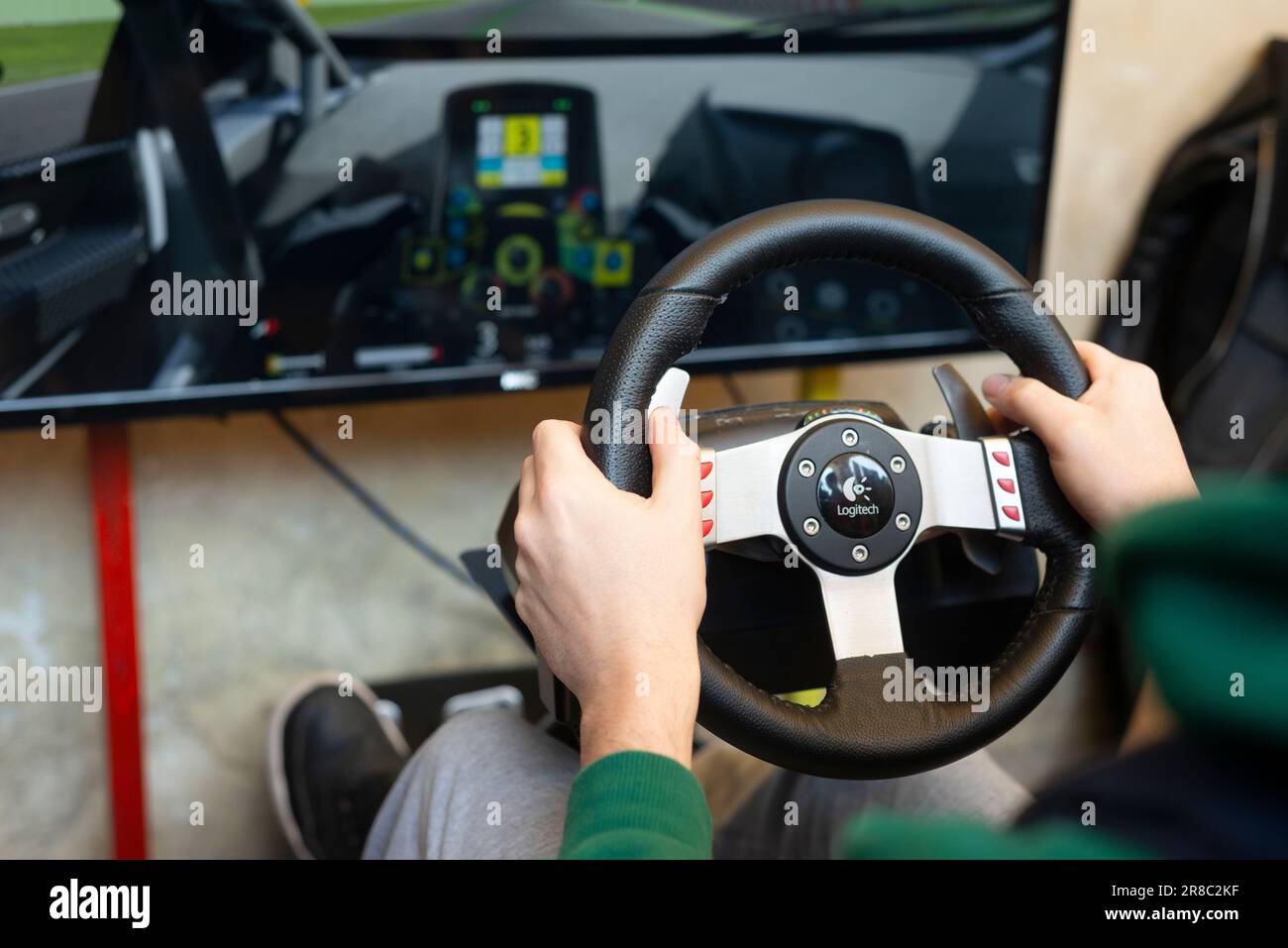 Hands of a Man on a Steering Wheel, While he Plays a Racing Game Stock ...