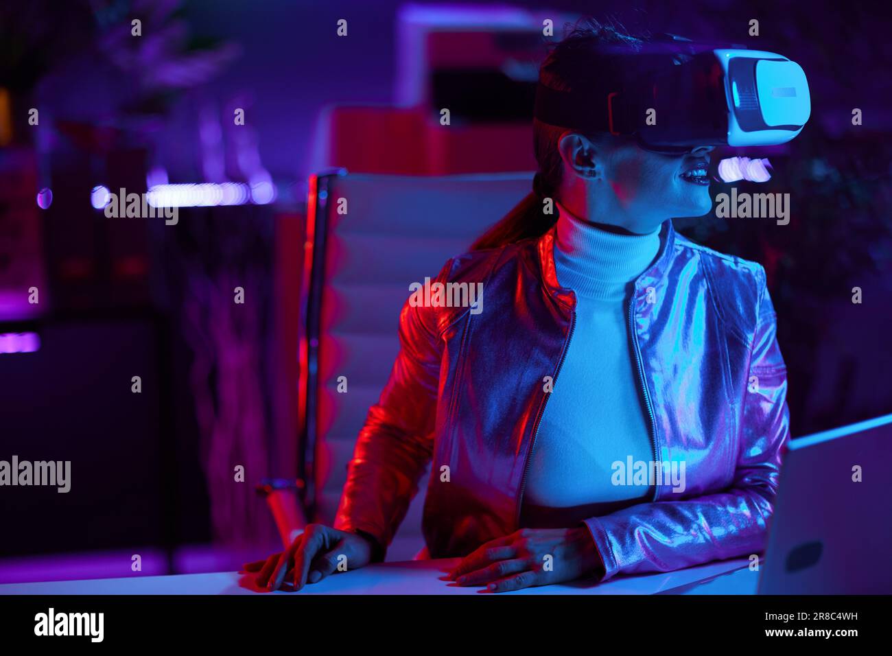 Neon metaverse futuristic concept. modern 40 years old woman in virtual ...