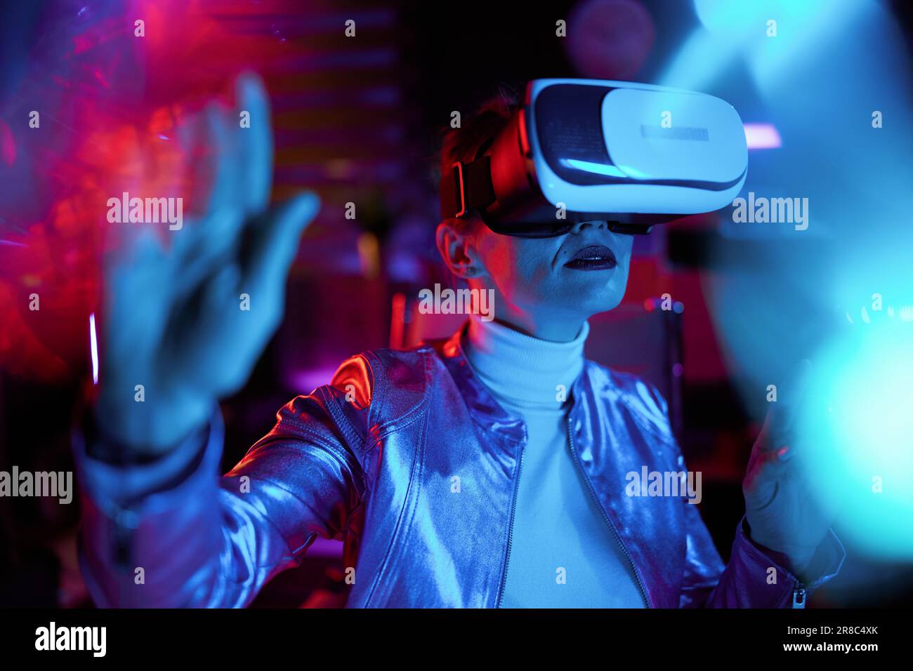 Neon metaverse futuristic concept. trendy 40 years old woman in virtual ...