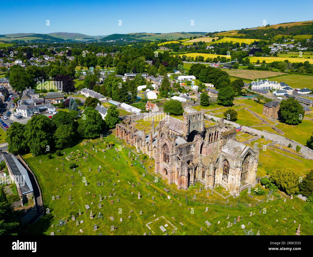Aerial view from drone of Melrose Abbey ruins in Scottish Borders ...
