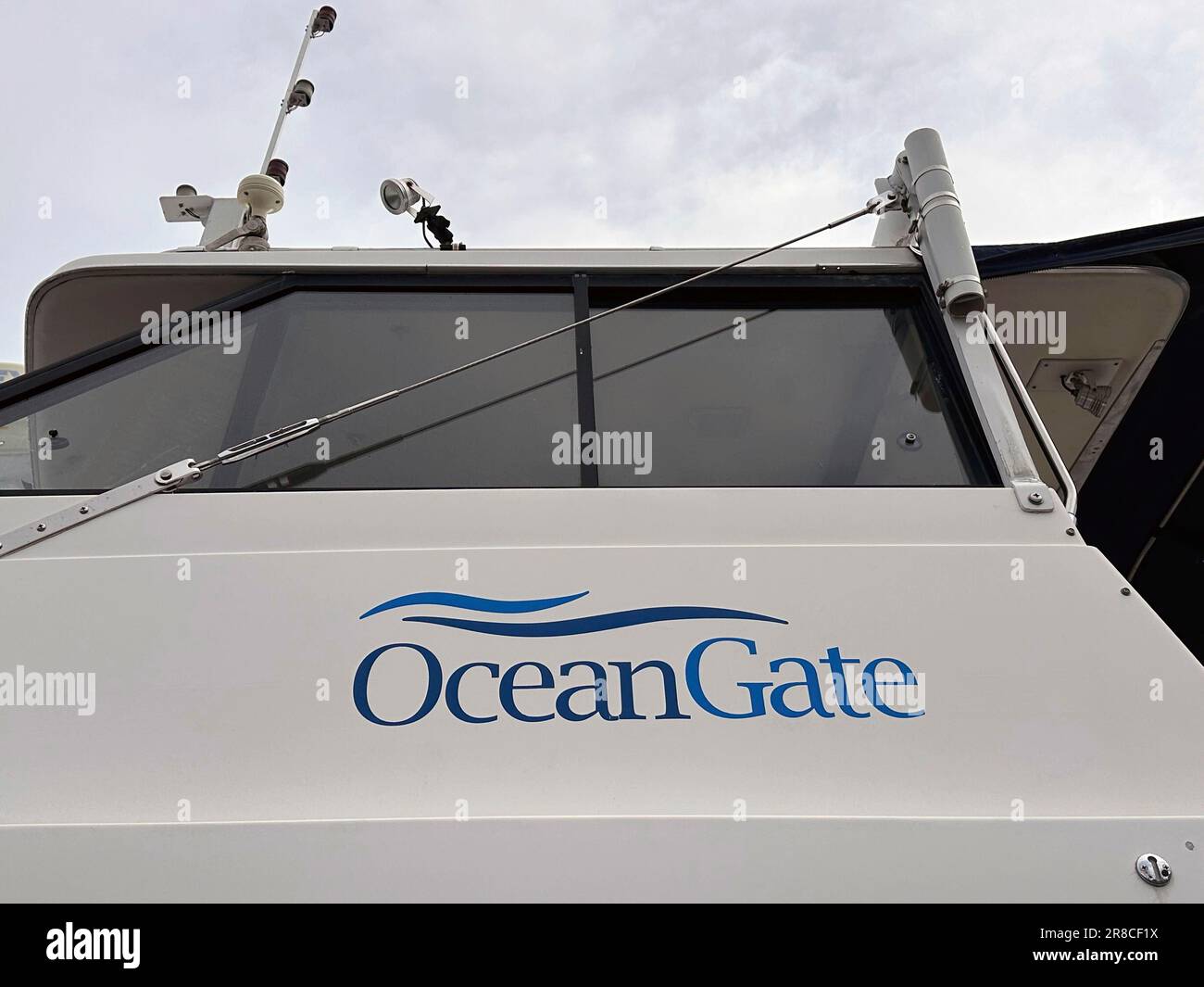 The logo for OceanGate Expeditions is seen on a boat parked near the ...