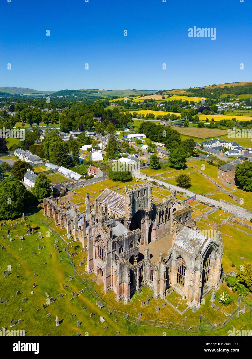 Aerial view from drone of Melrose Abbey ruins in Scottish Borders ...