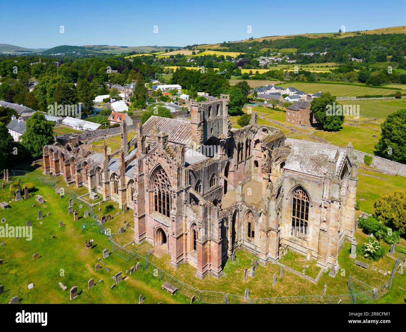 Aerial view from drone of Melrose Abbey ruins in Scottish Borders ...