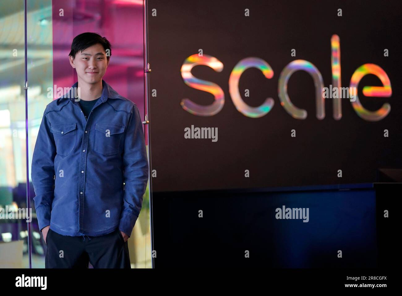 Scale AI founder and CEO Alexandr Wang poses for photos at the company's office in San Francisco ...