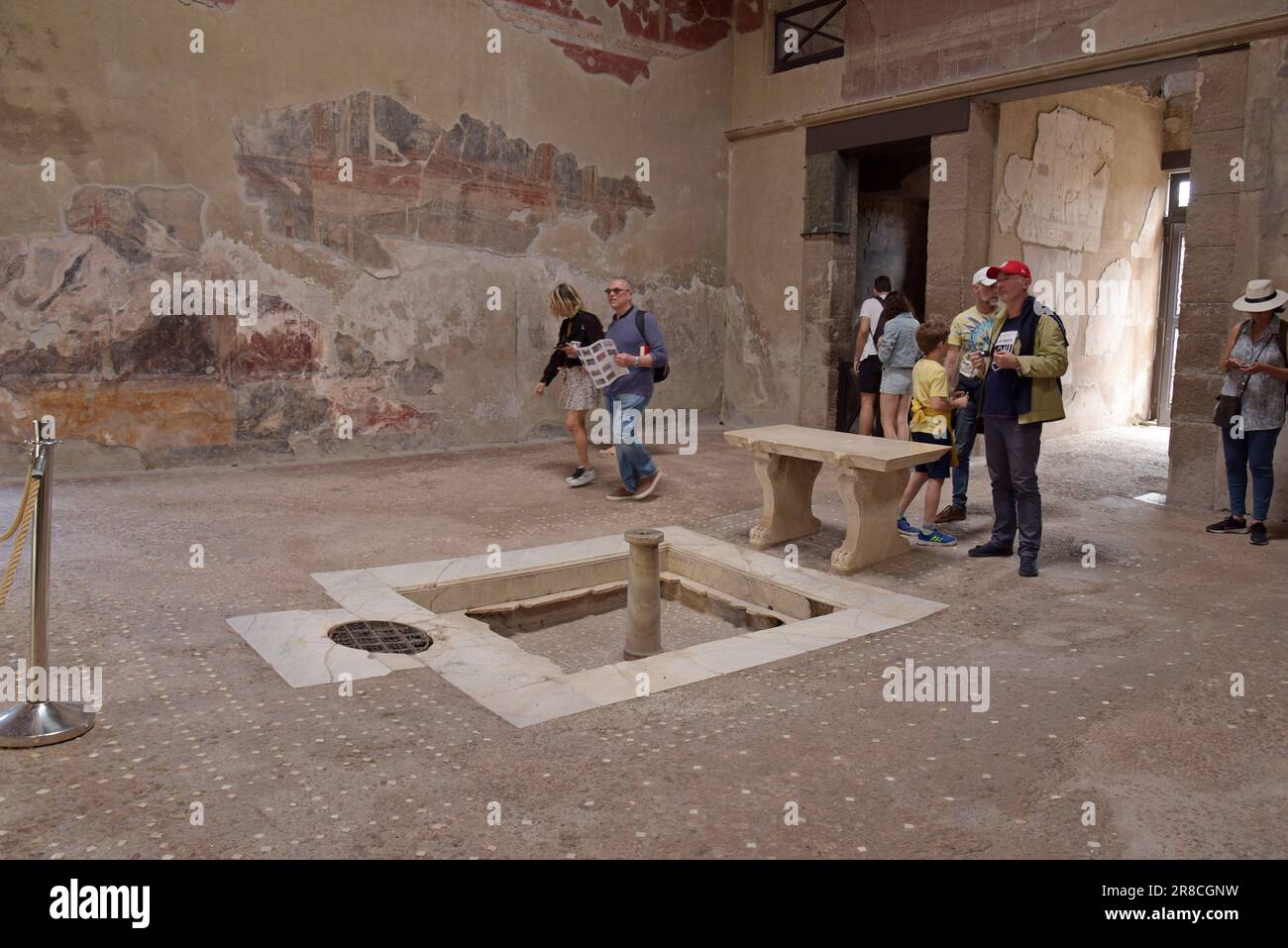 Tourists viewing the preserved Roman town of Herculaneumm buried in the ...