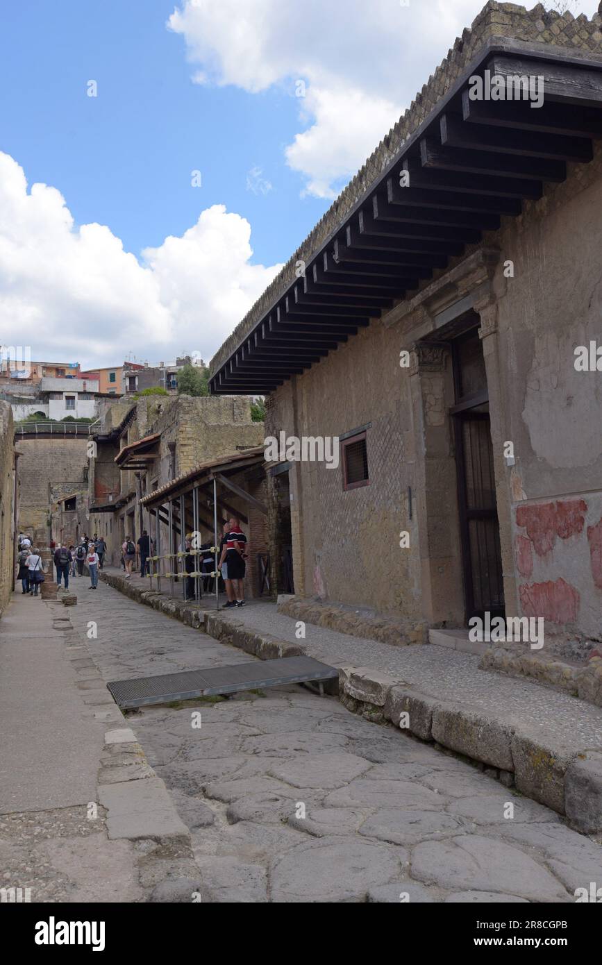Tourists viewing the preserved Roman town of Herculaneumm buried in the ...