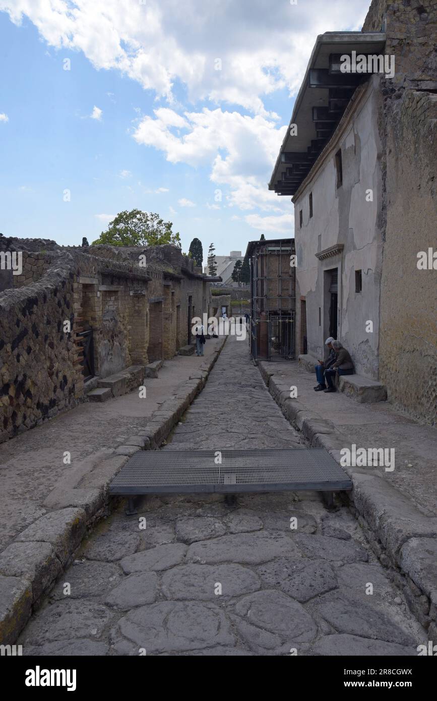 Tourists viewing the preserved Roman town of Herculaneumm buried in the ...