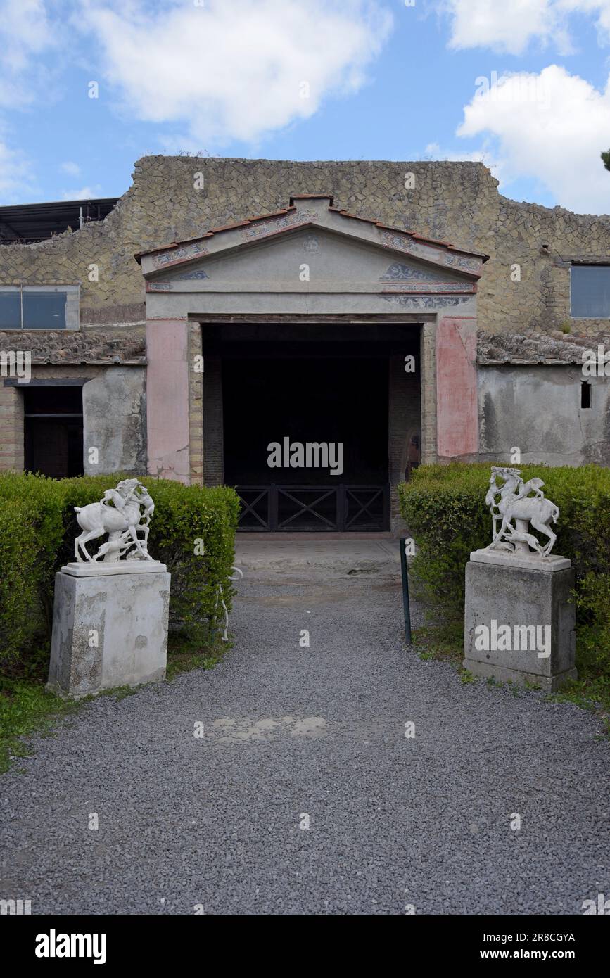 Marble statues at the entrance to a house at the Roman town of ...
