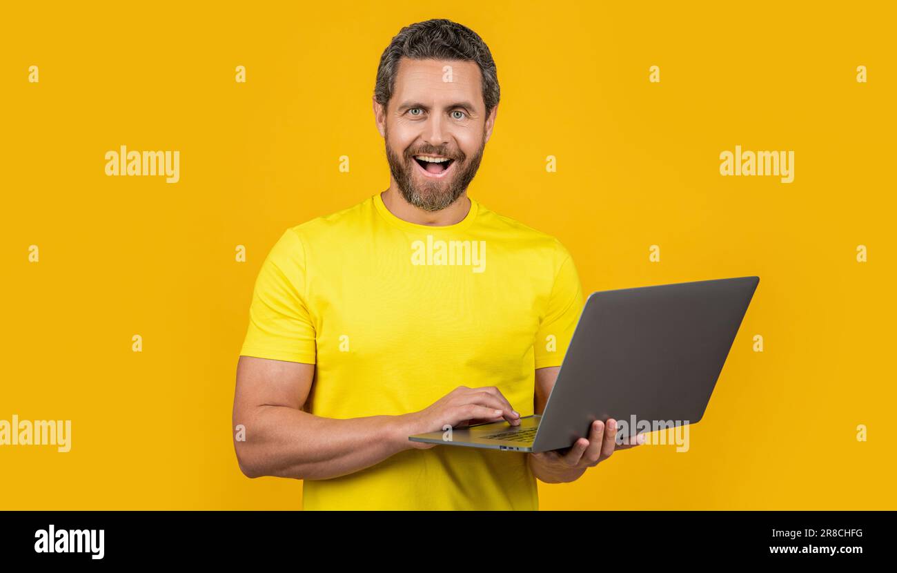 glad man programmer in studio. photo of man programmer with laptop ...
