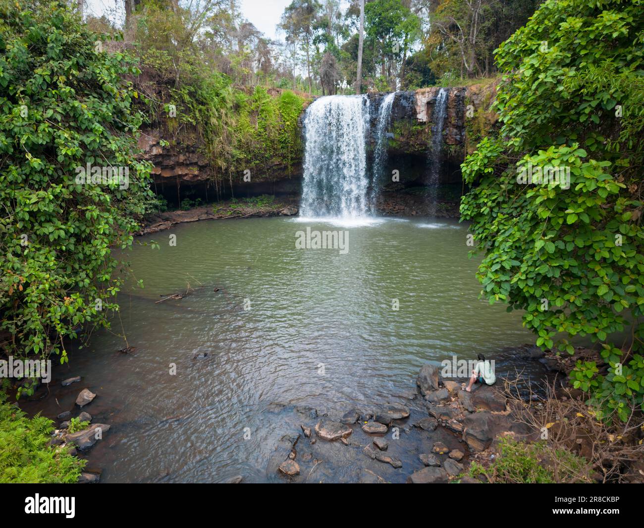 The Kachanh Waterfall surrounded by greenery in Cambodia Stock Photo ...