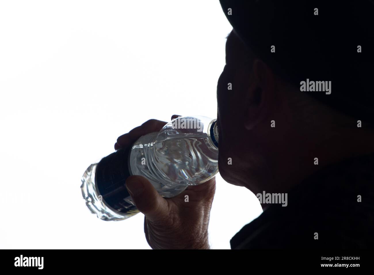 Simple image of person quenching their thirst with water from a clear ...