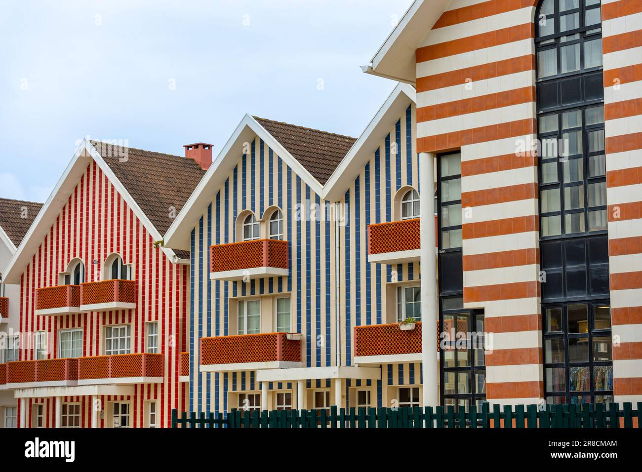 A row of brightly colored residential buildings in a suburban ...