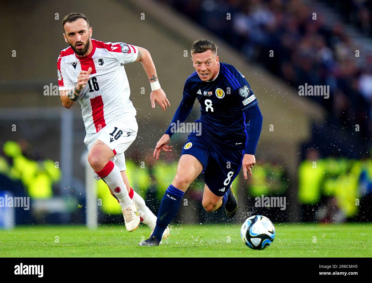 Scotland's Callum McGregor (right) and Georgia's Nika Kvekveskiri ...