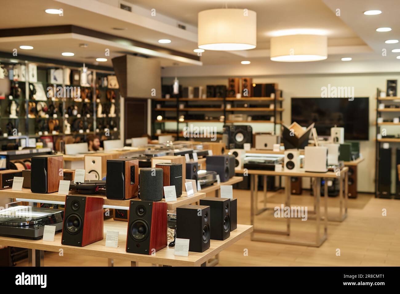 Background image of speakers and music equipment on display in music ...