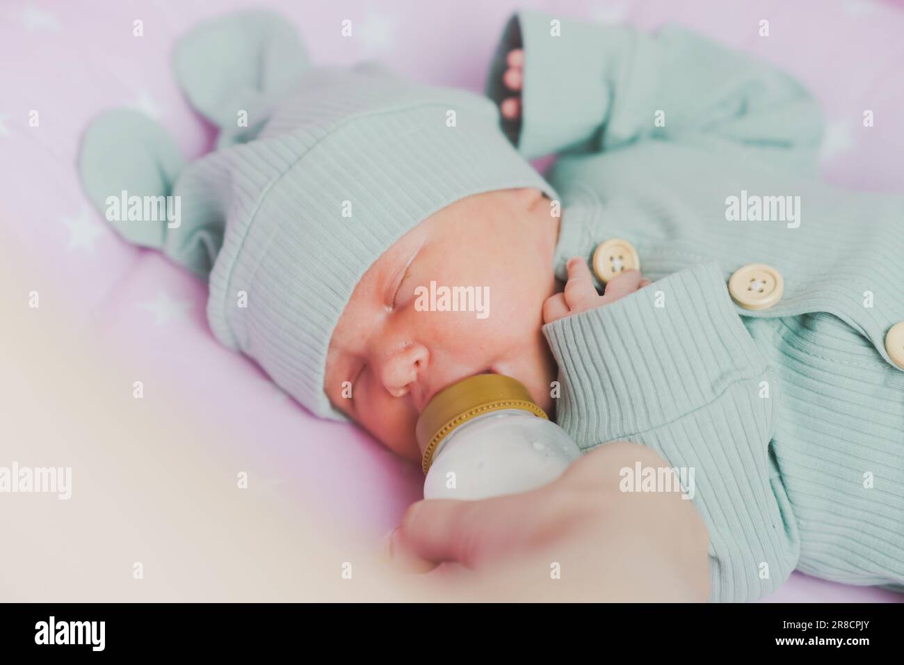 newborn baby crying lying in the crib. New born child tired and hungry ...